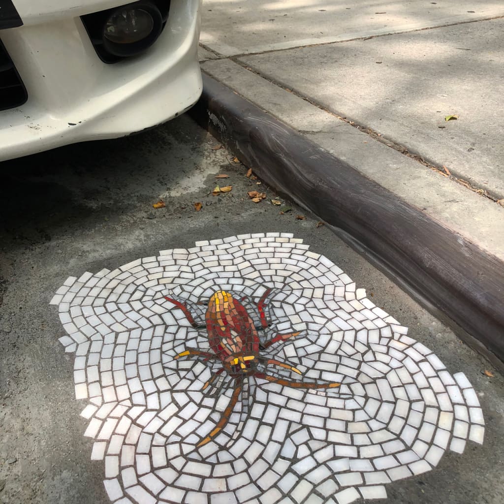 This artist quietly fixed a pothole with a mosaic of Trump's face ...