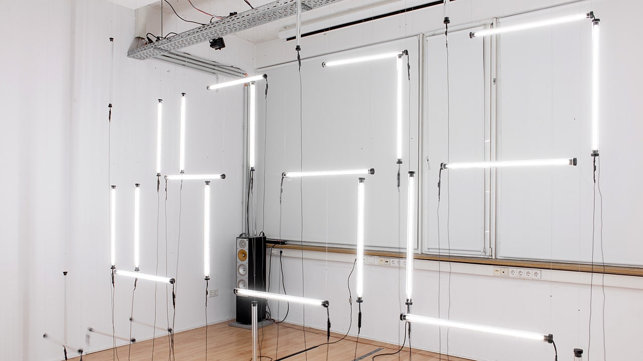 Watch: Dancing Neon Lights Build A Giant Digital Clock - Fast Company