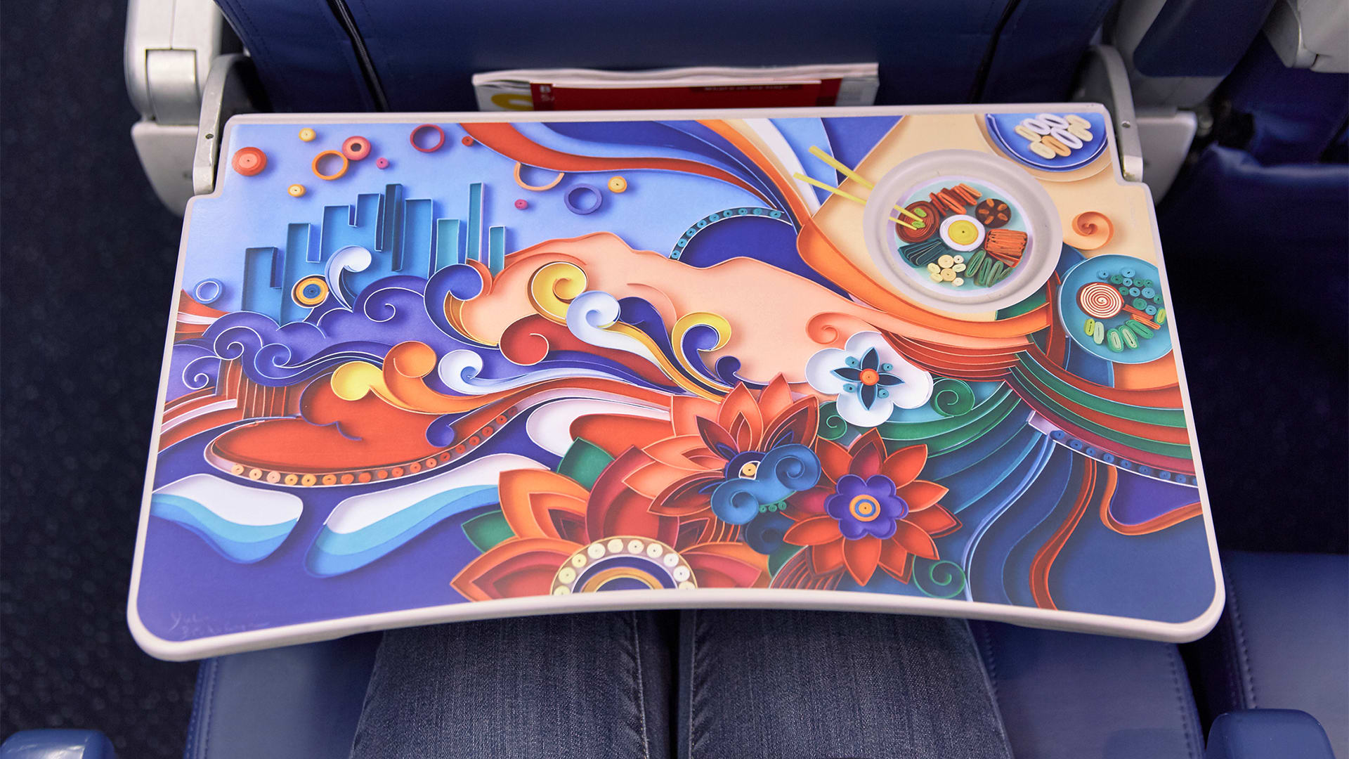 The Next Frontier For Public Art? Airline Tray Tables - Fast Company