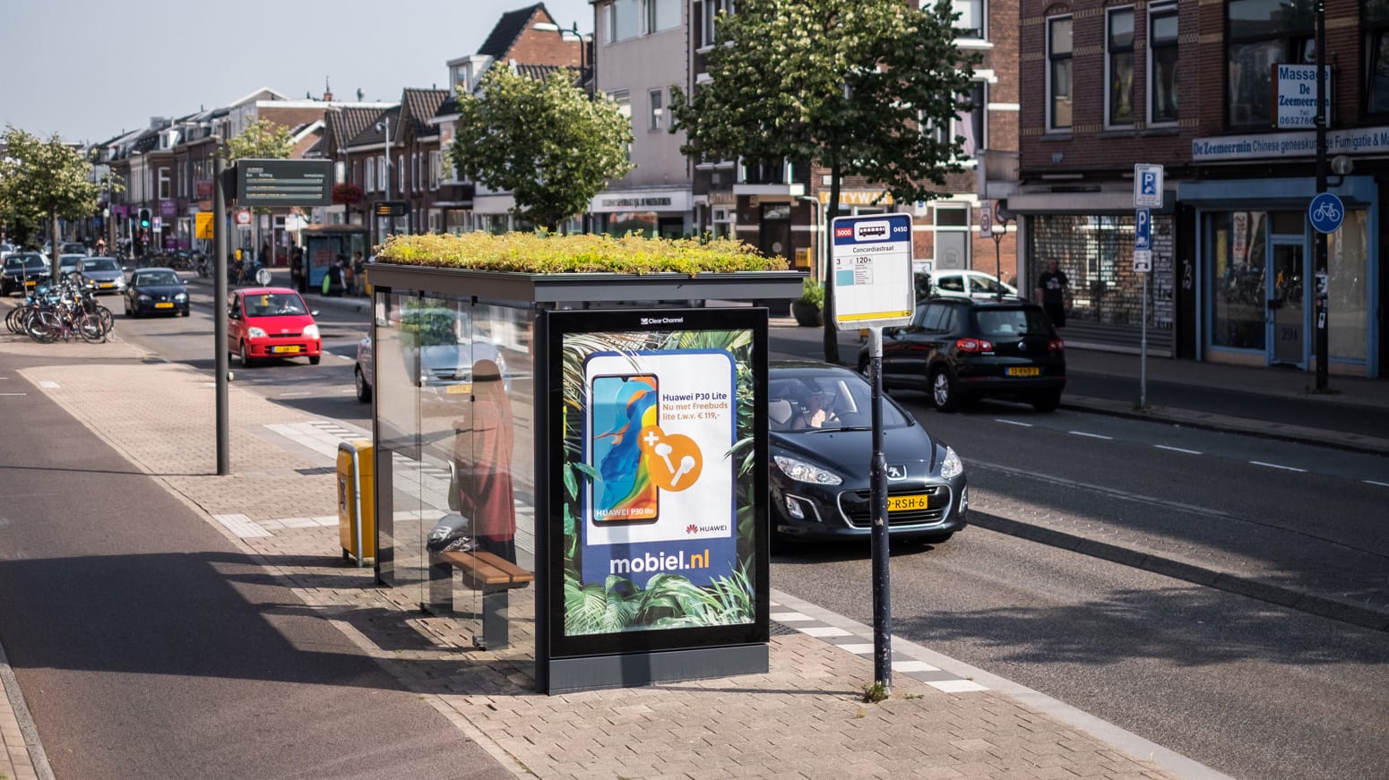 There are tiny parks for bees hiding on the roof of these bus stops ...