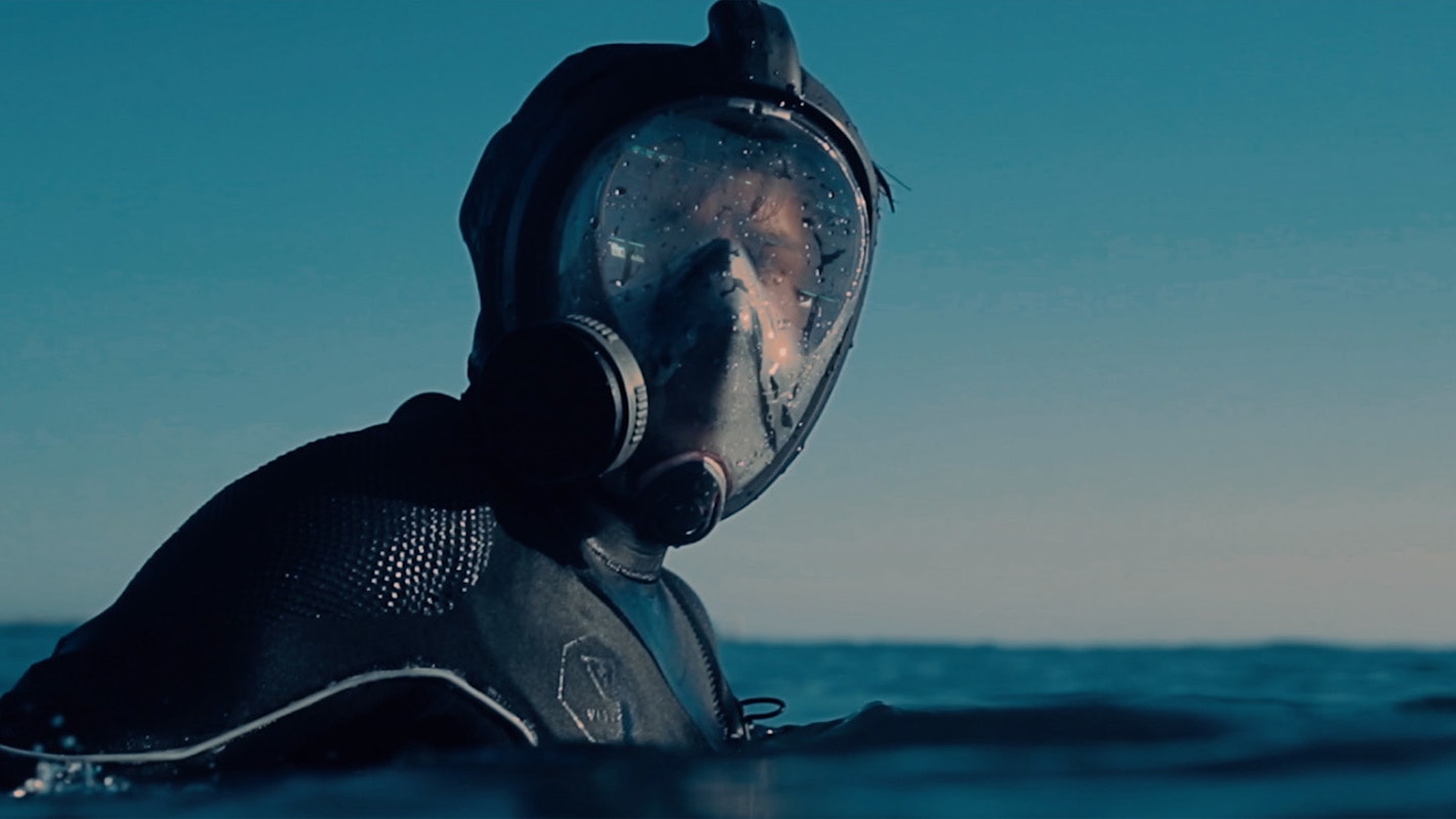 Watch a surfer shred in the postapocalyptic wetsuit of the future ...