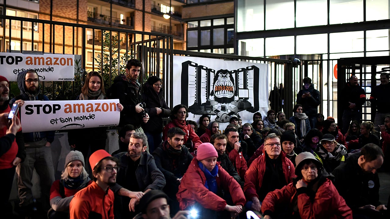 Black Friday protests: Climate change activists block access to Amazon ...
