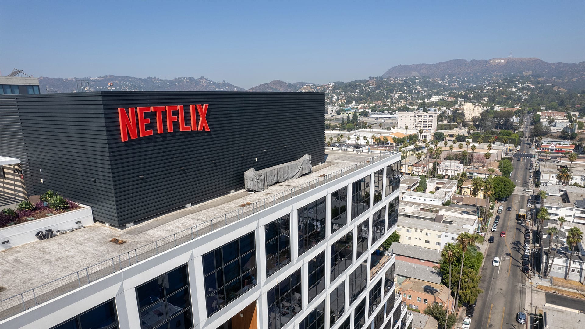 Netflix stock flirts with $1000; price hikes, live sports, Squid Game ...