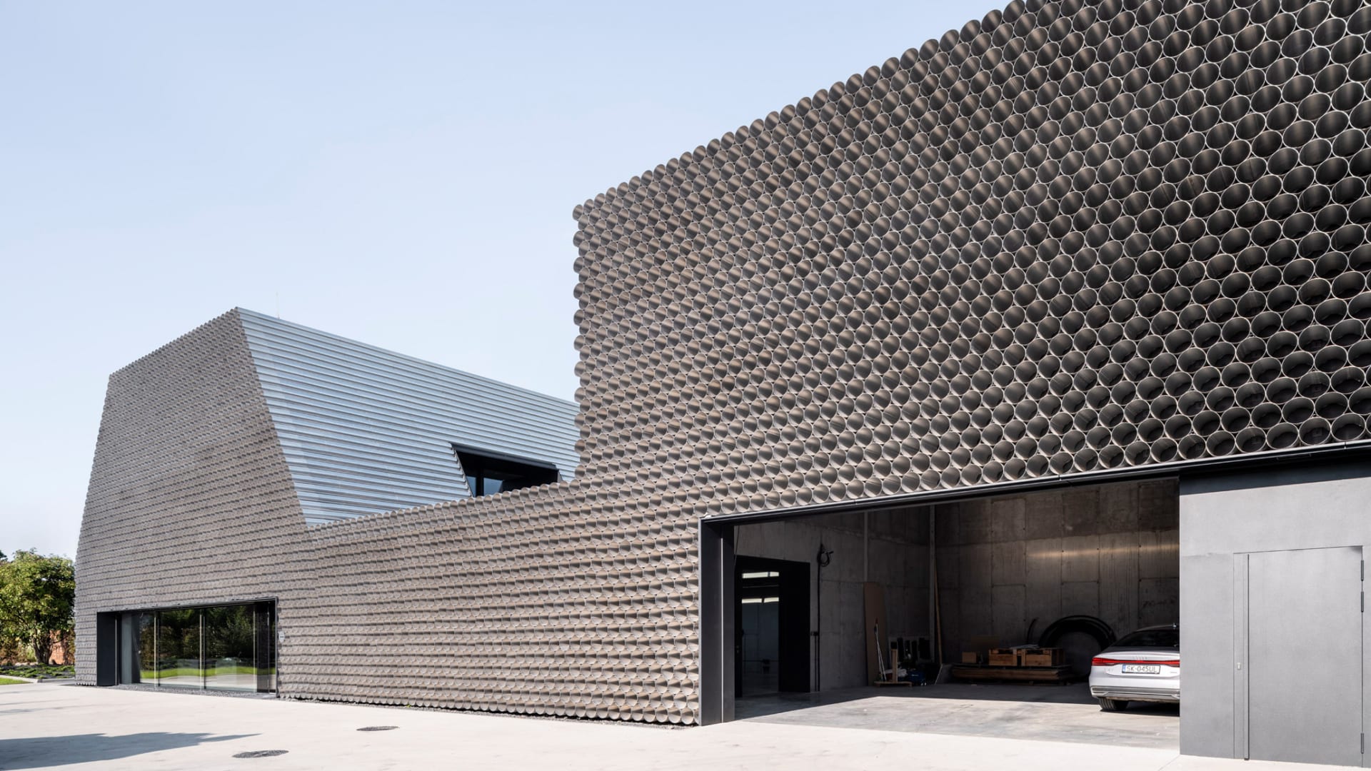 This striking building is for a pipe company, and it’s built entirely ...
