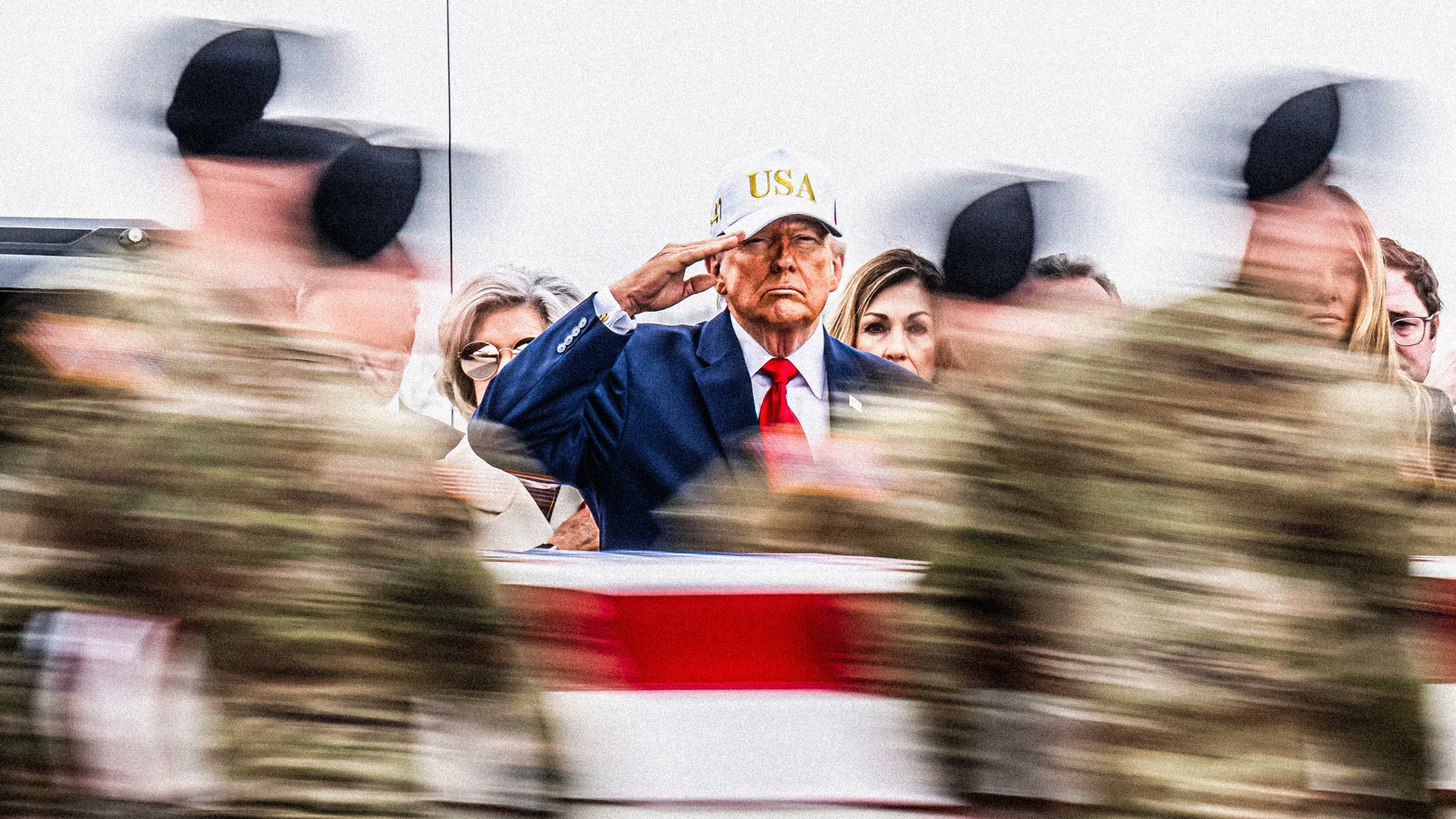 President Trump wears a branded hat during the country's most solemn ...