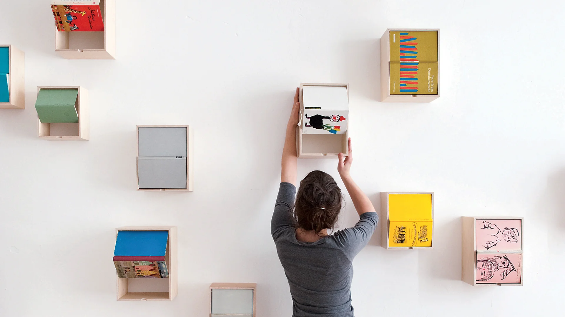Turn Beautiful Book Covers Into Wall Art That Doubles As Storage - Fast ...