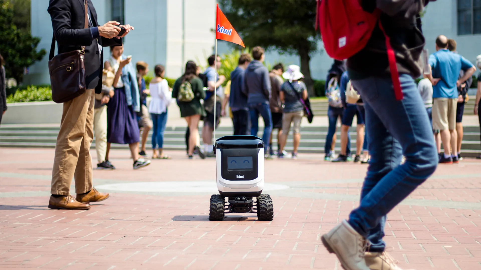 Watch as a Kiwi delivery robot bursts into flames on a California ...