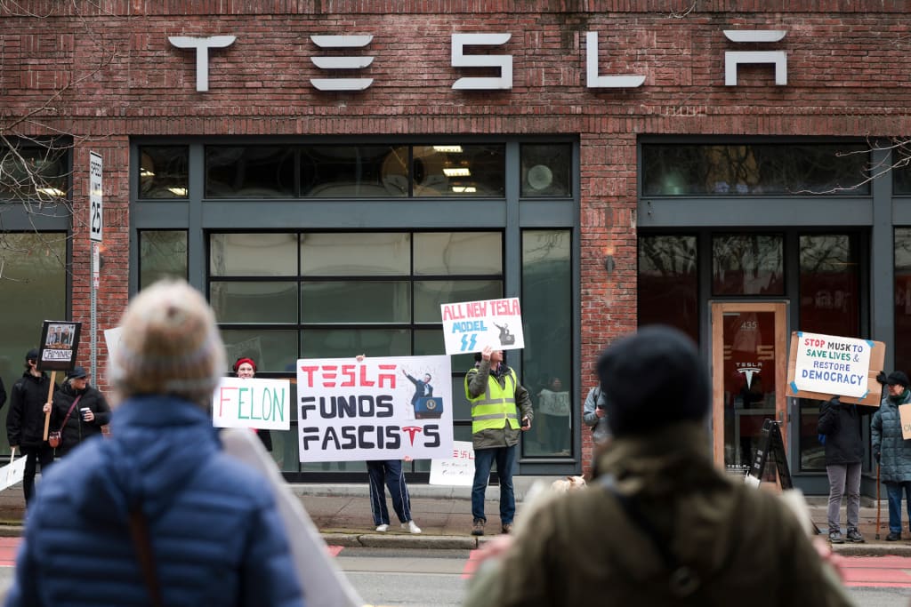 Tesla dealership protests have inspired a new generation of signs ...