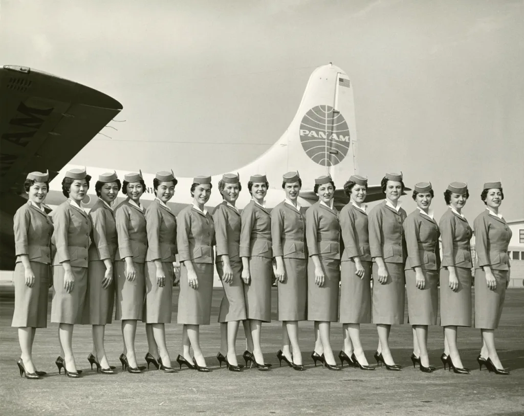 A Cultural History Of Flight Attendant Uniforms, From Go-Go Boots To ...