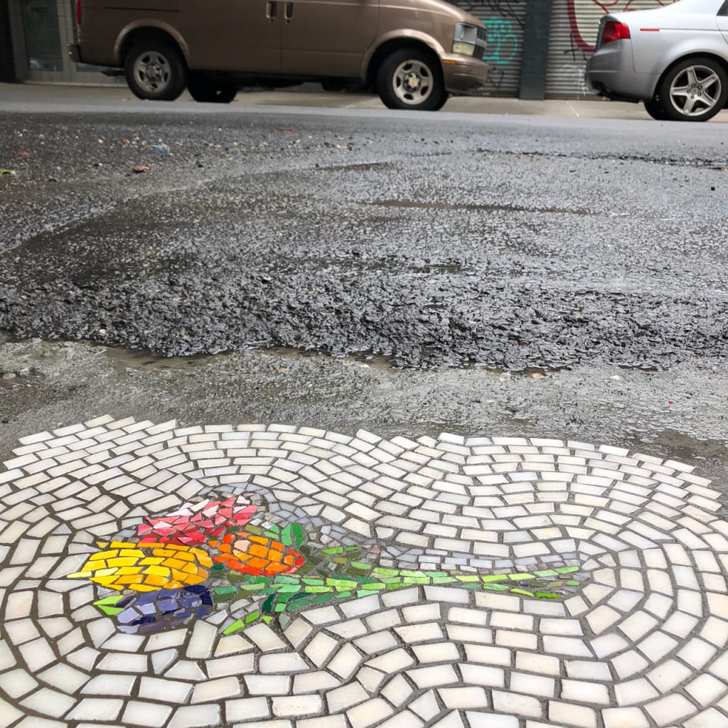 This artist quietly fixed a pothole with a mosaic of Trump's face ...
