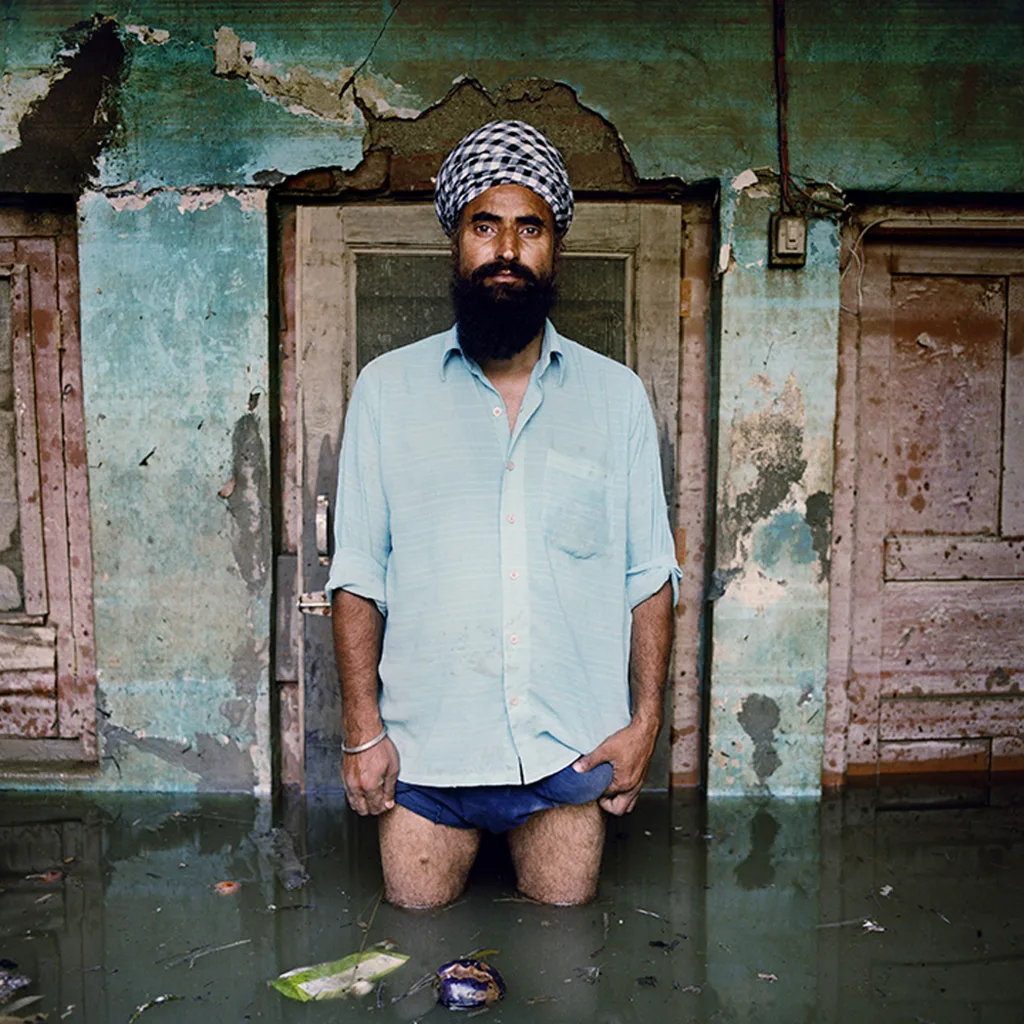 These photos of flood victims tell the human story of climate change ...