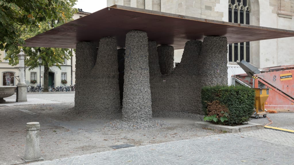 See a bizarre robot make a building out of loose rocks and string ...