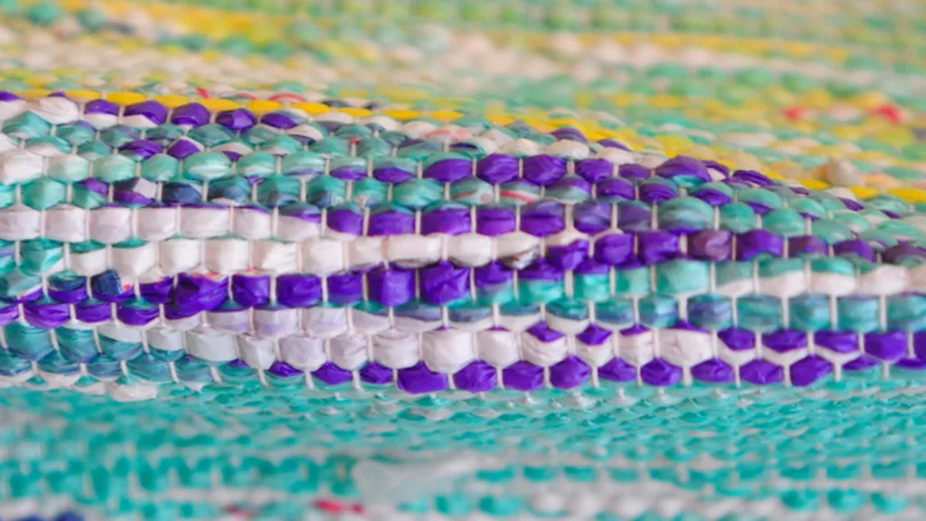 This beautiful new fabric is actually old plastic bags woven on a loom ...