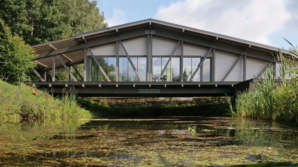 Would you live on a bridge? This elegant home hovers over a river ...