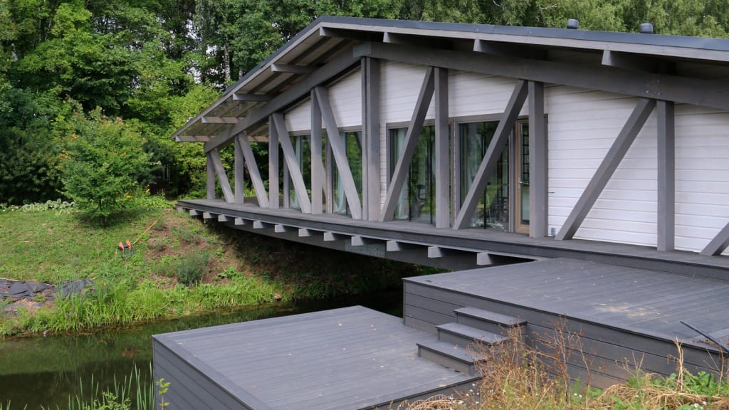 Would you live on a bridge? This elegant home hovers over a river ...