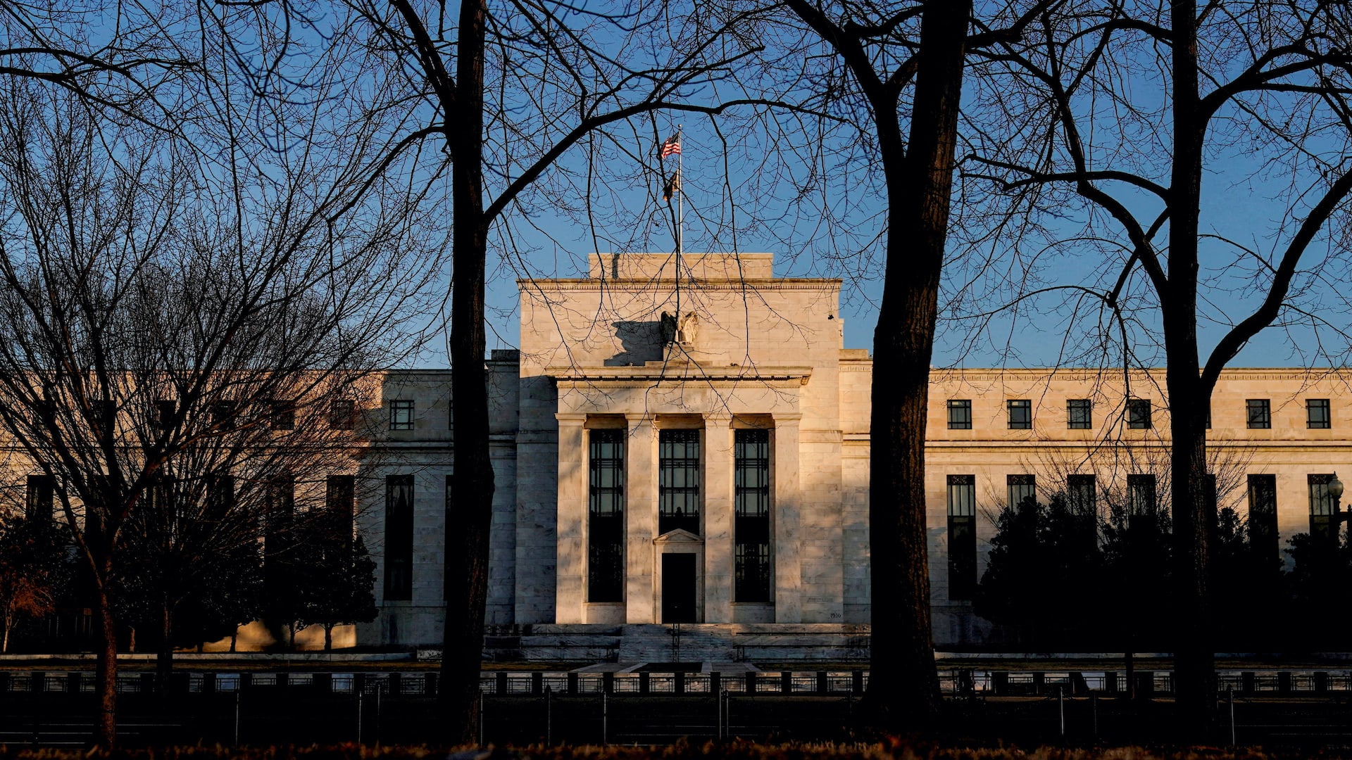 Fed holds interest rates steady, forseeing less growth and higher ...