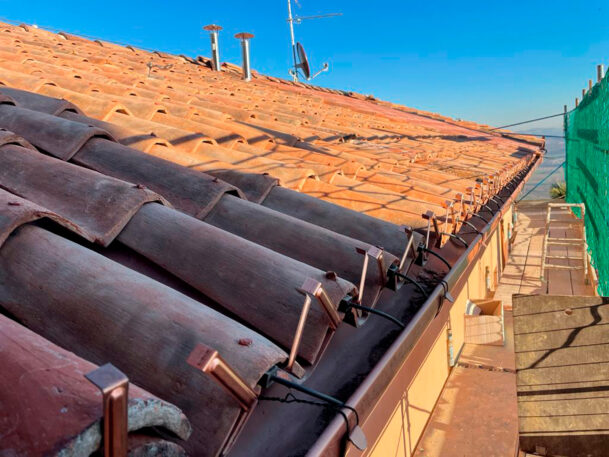 These 'terra-cotta' tiles blend in perfectly with Italian roofs. But ...
